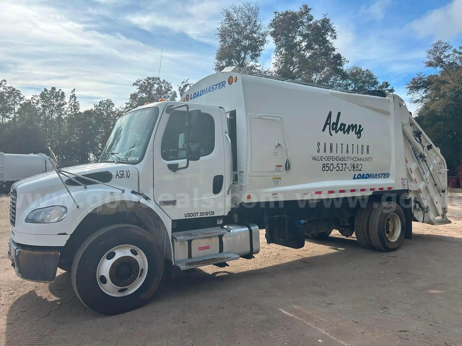 2021 Freightliner M2 106 with 20-yard Loadmaster rear load body. For ...